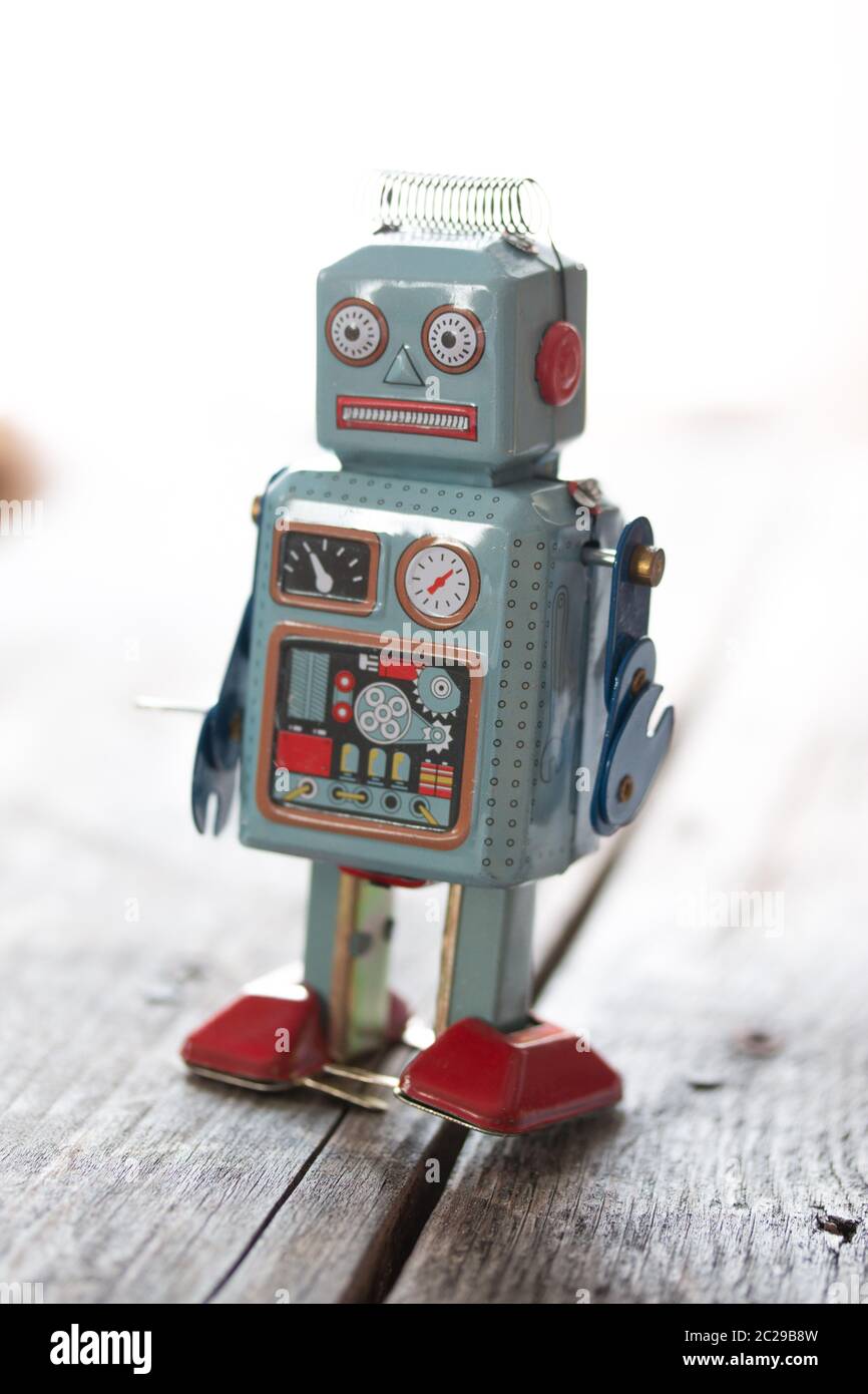 Robot toy, symbol for a chatbot or social bot and algorithms. Wood ...