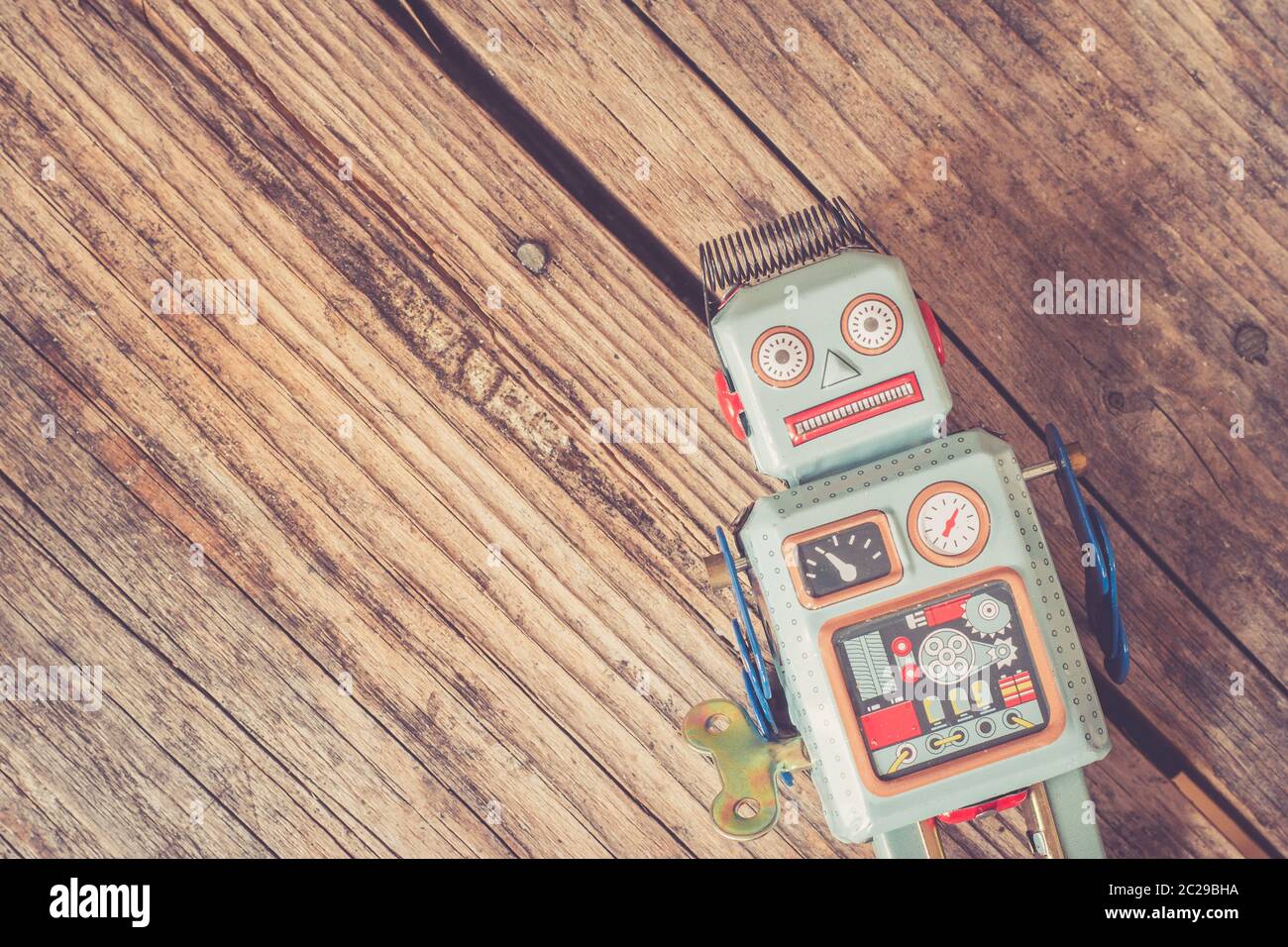 Robot toy, symbol for a chatbot or social bot and algorithms. Wood ...