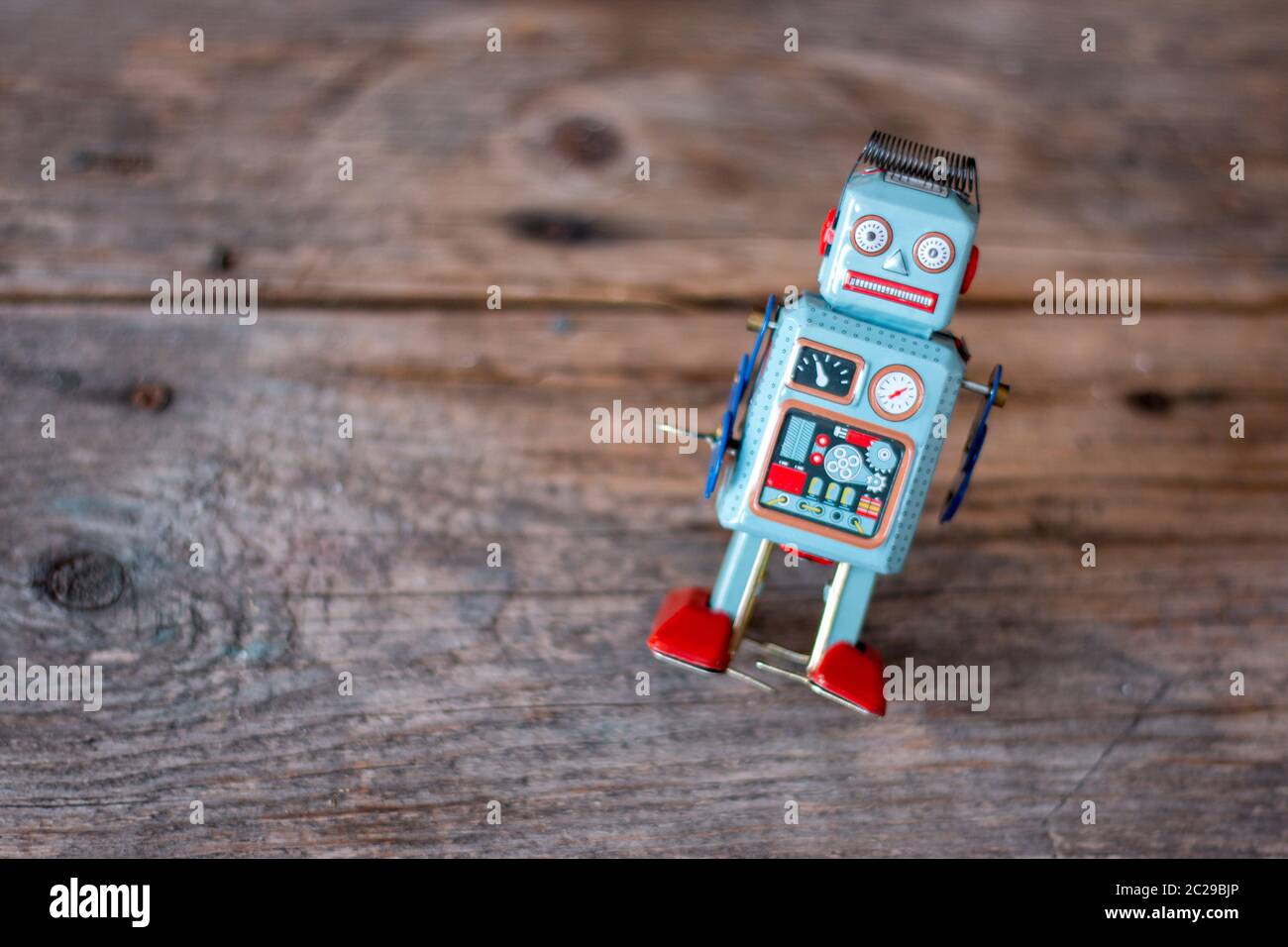 Robot toy, symbol for a chatbot or social bot and algorithms. Wood ...