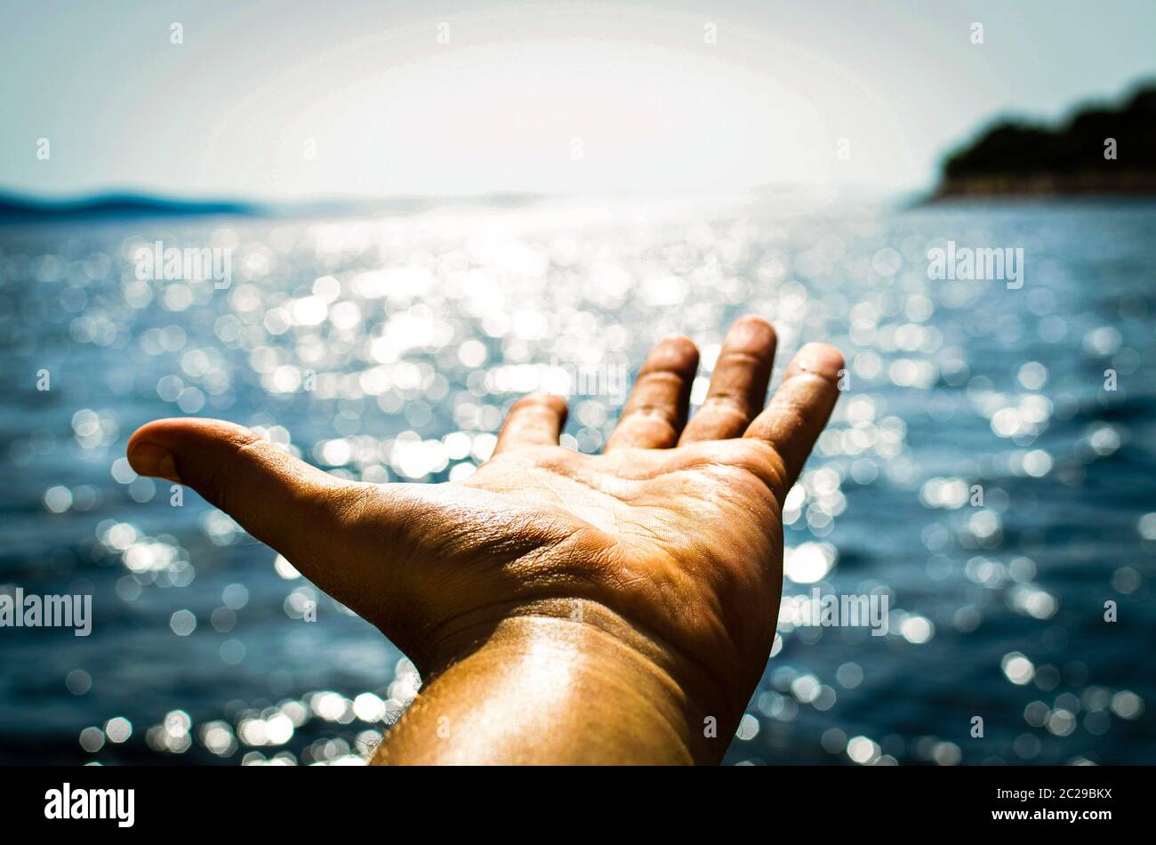 Open hand of Friendship with sea in background and copy space Stock ...