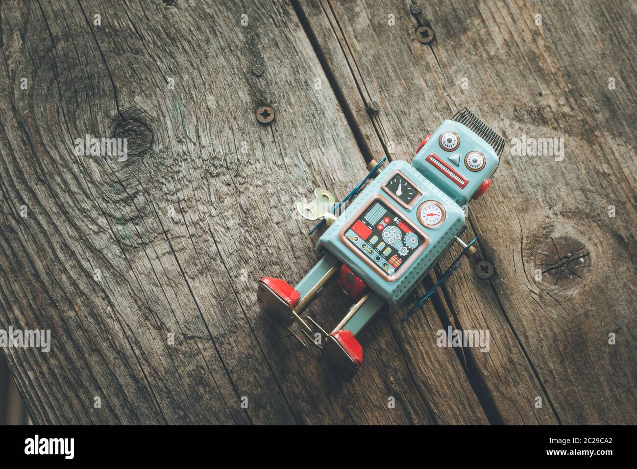 Robot toy, symbol for a chatbot or social bot and algorithms. Wood ...