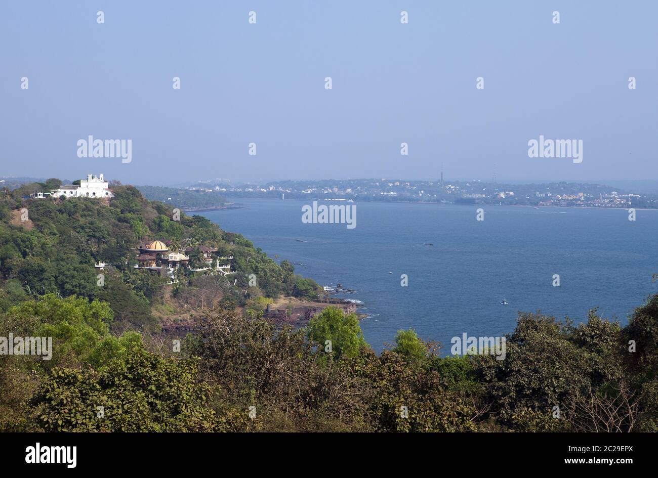 India. Goa View of the sea and the old colonial buildings on the hill ...