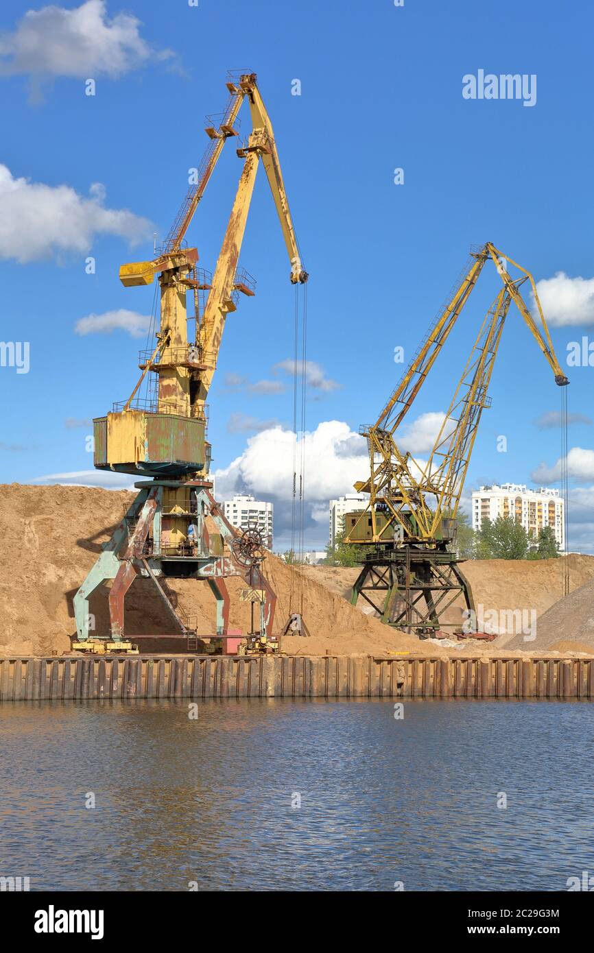 Industrial crane for unloading and loading in the river port Stock ...