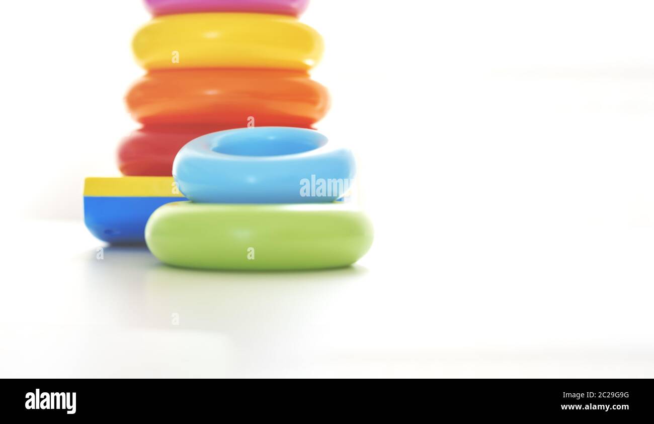 Colorful plastic rings on a white background to be stacked in a tower ...