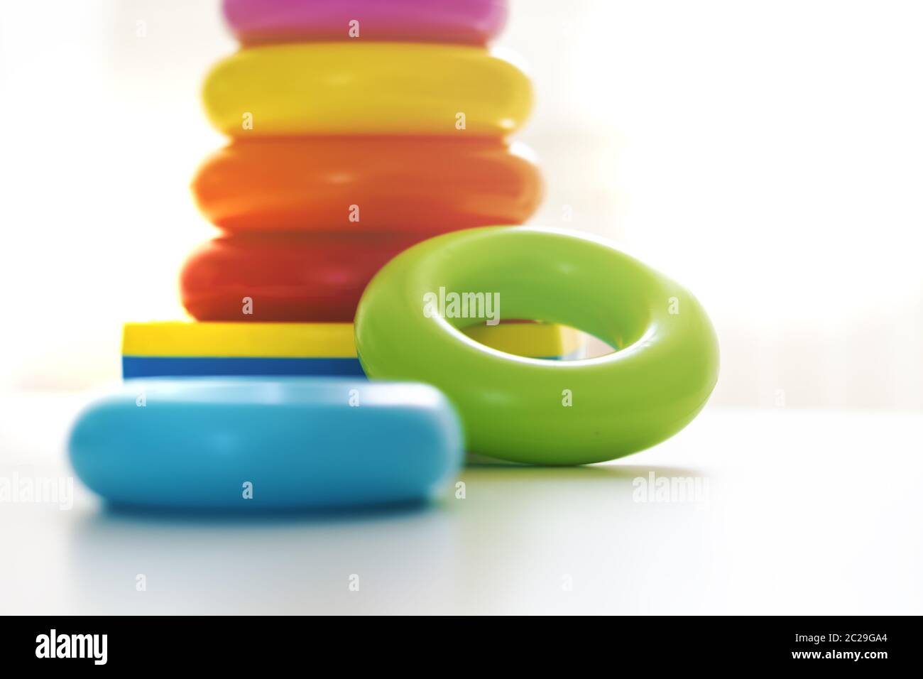 Colorful plastic rings on a white background to be stacked in a tower ...
