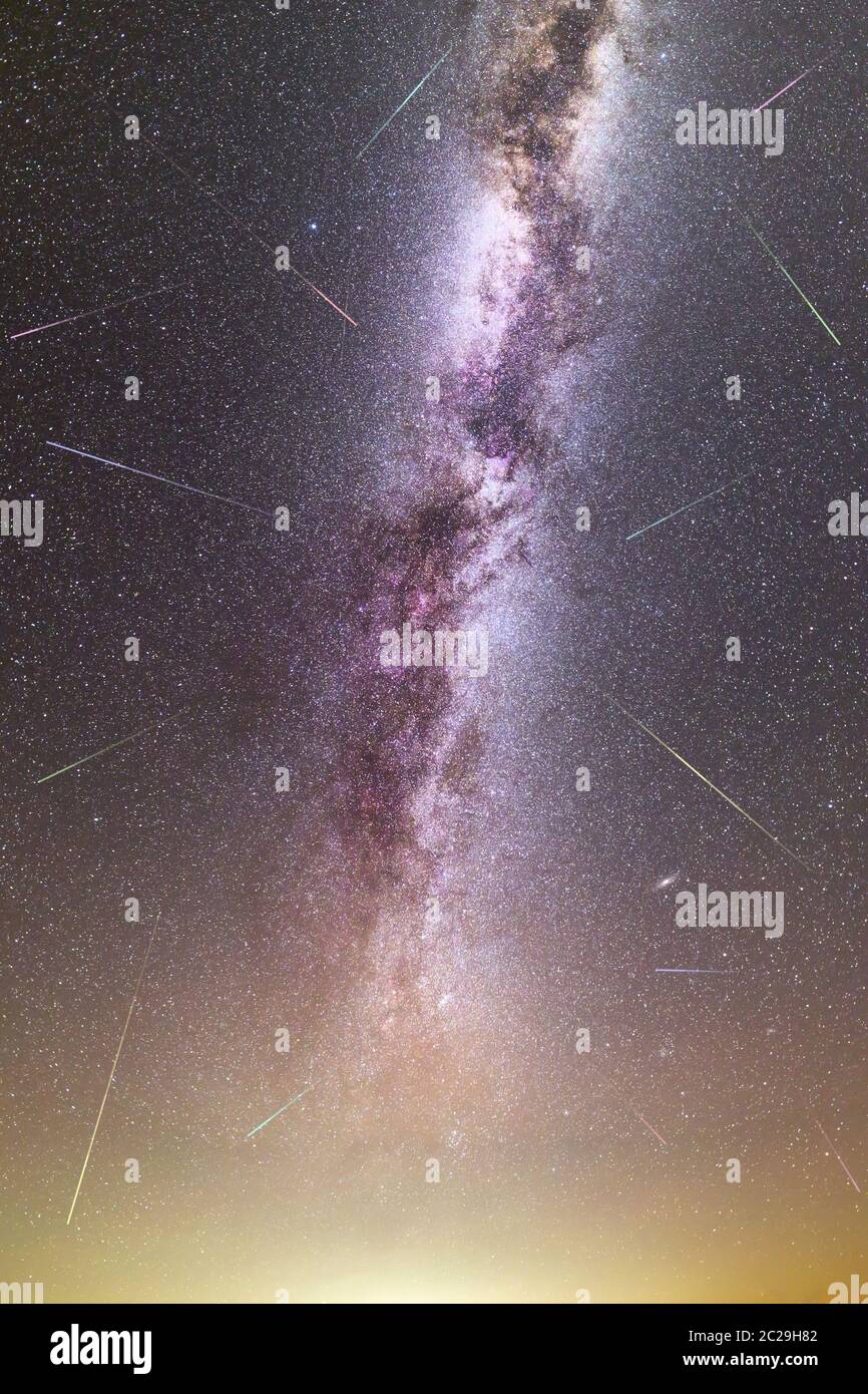 Purple Milky way falling stars purple Stock Photo - Alamy