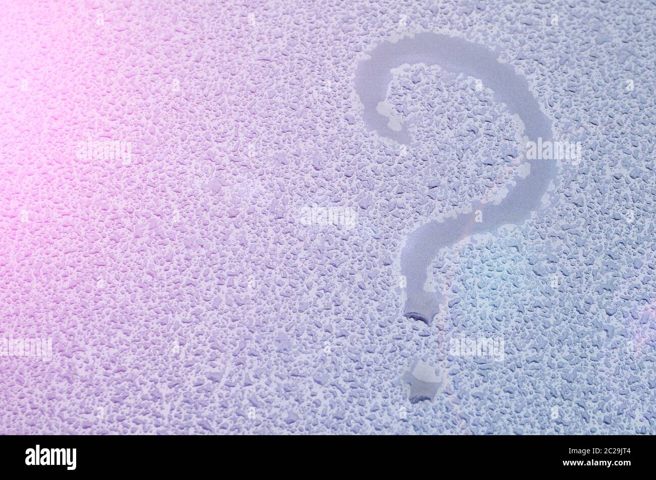 Question mark. The inscription on a wet metal surface. In the summer ...