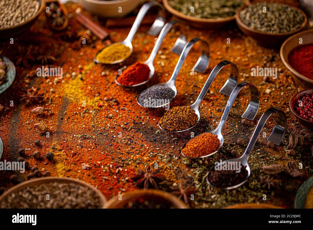 Collection of spices in spoon. Spice and herb concept Stock Photo - Alamy