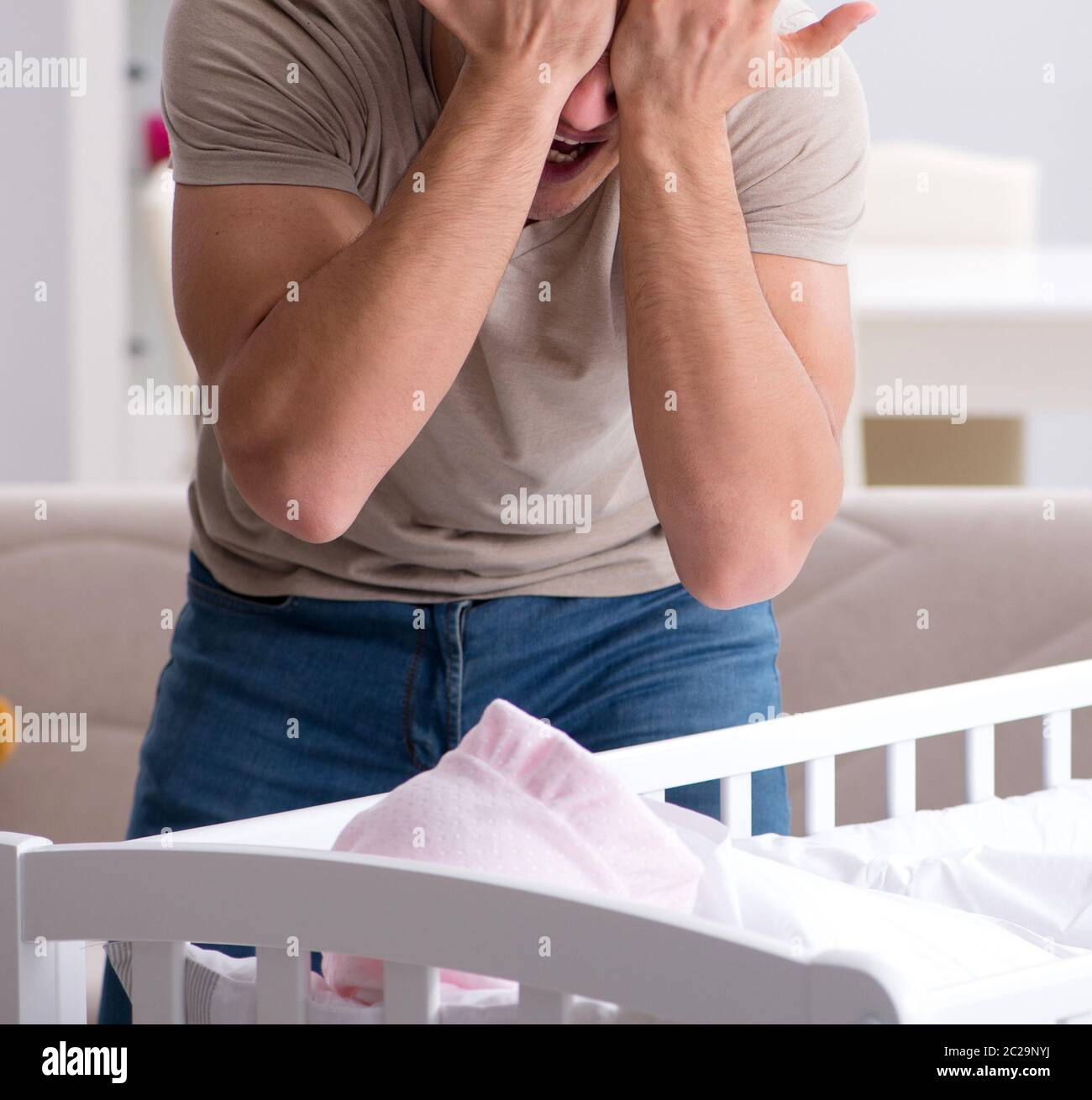 Young father dad frustrated at crying baby Stock Photo - Alamy