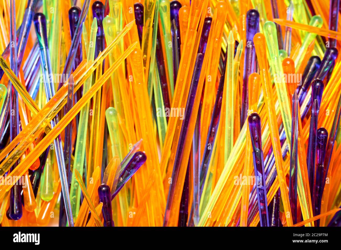 lots of plastic colorful cheese pickers Stock Photo - Alamy