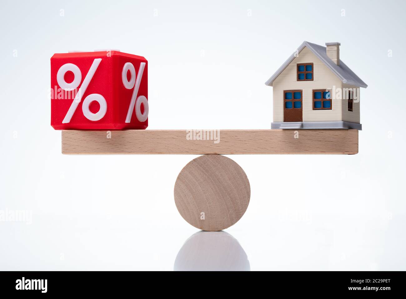 Seesaw Showing Balance Between Percentage Symbol And House Model Stock ...