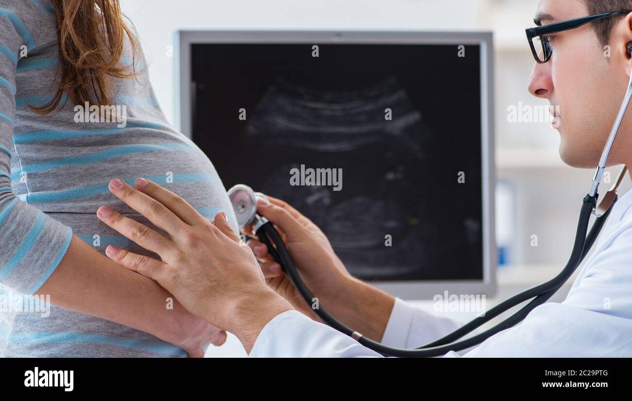 Pregnant woman visiting doctor for regular check-up Stock Photo - Alamy