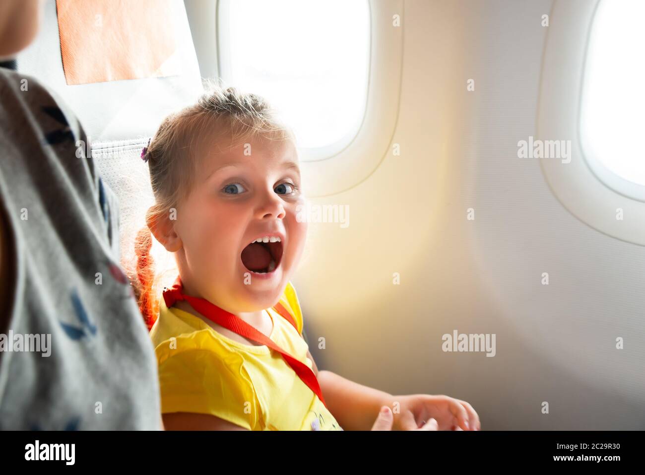 Child screaming airplane hi-res stock photography and images - Alamy