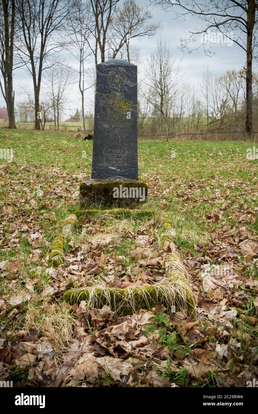 A look at an old, weathered gravestone at the Jewish cemetery. In ...
