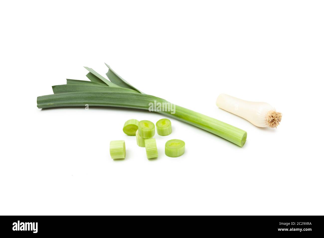 Green leek sliced isolated on white background Stock Photo - Alamy