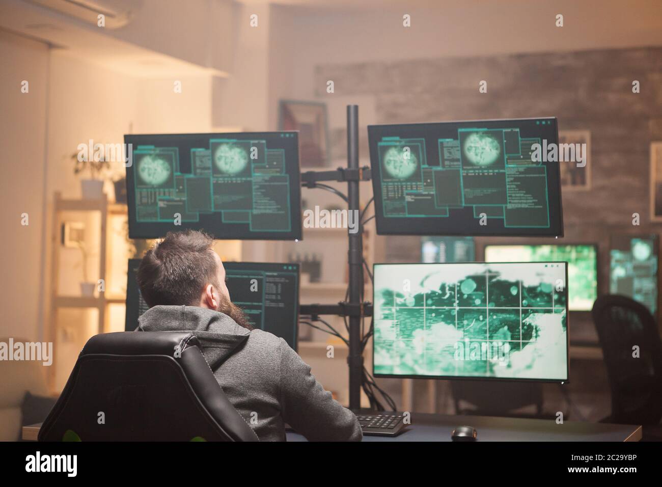 Dangerous hacker writing a malware to hack a network. Hacker with ...