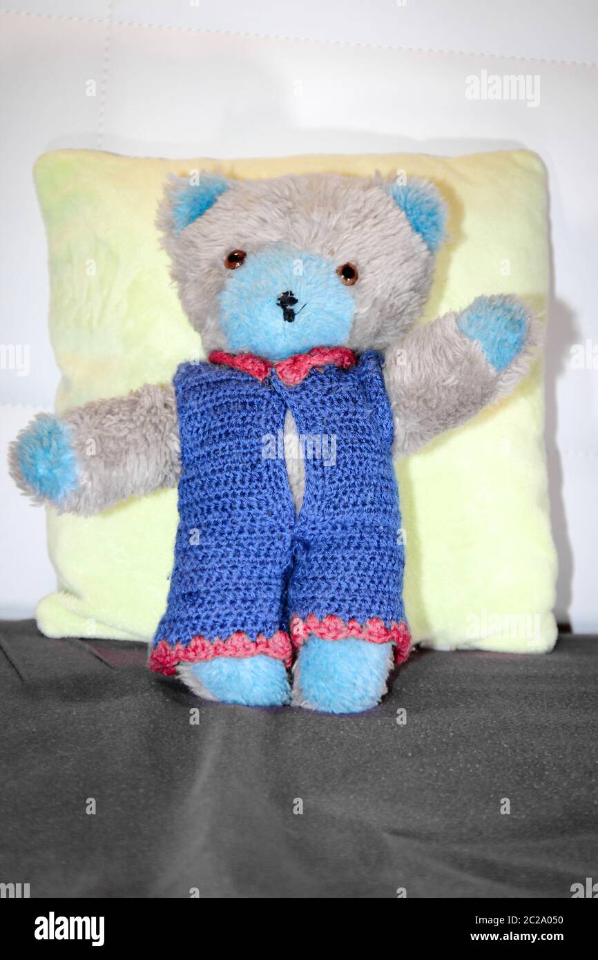 An old gray blue teddy bear Stock Photo - Alamy
