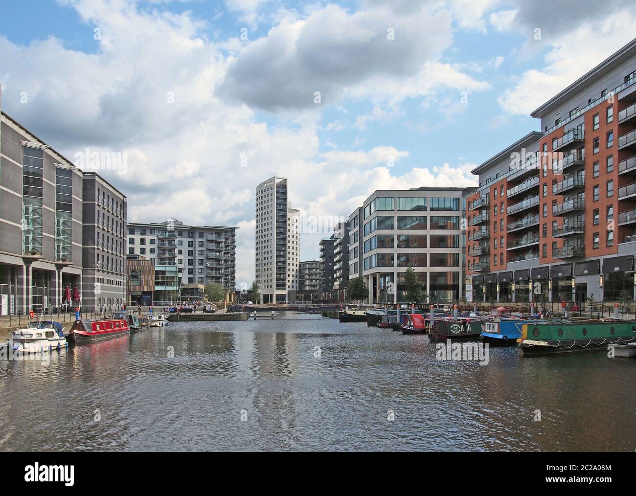 a view of of leeds dock with modern apartment developments and bars ...