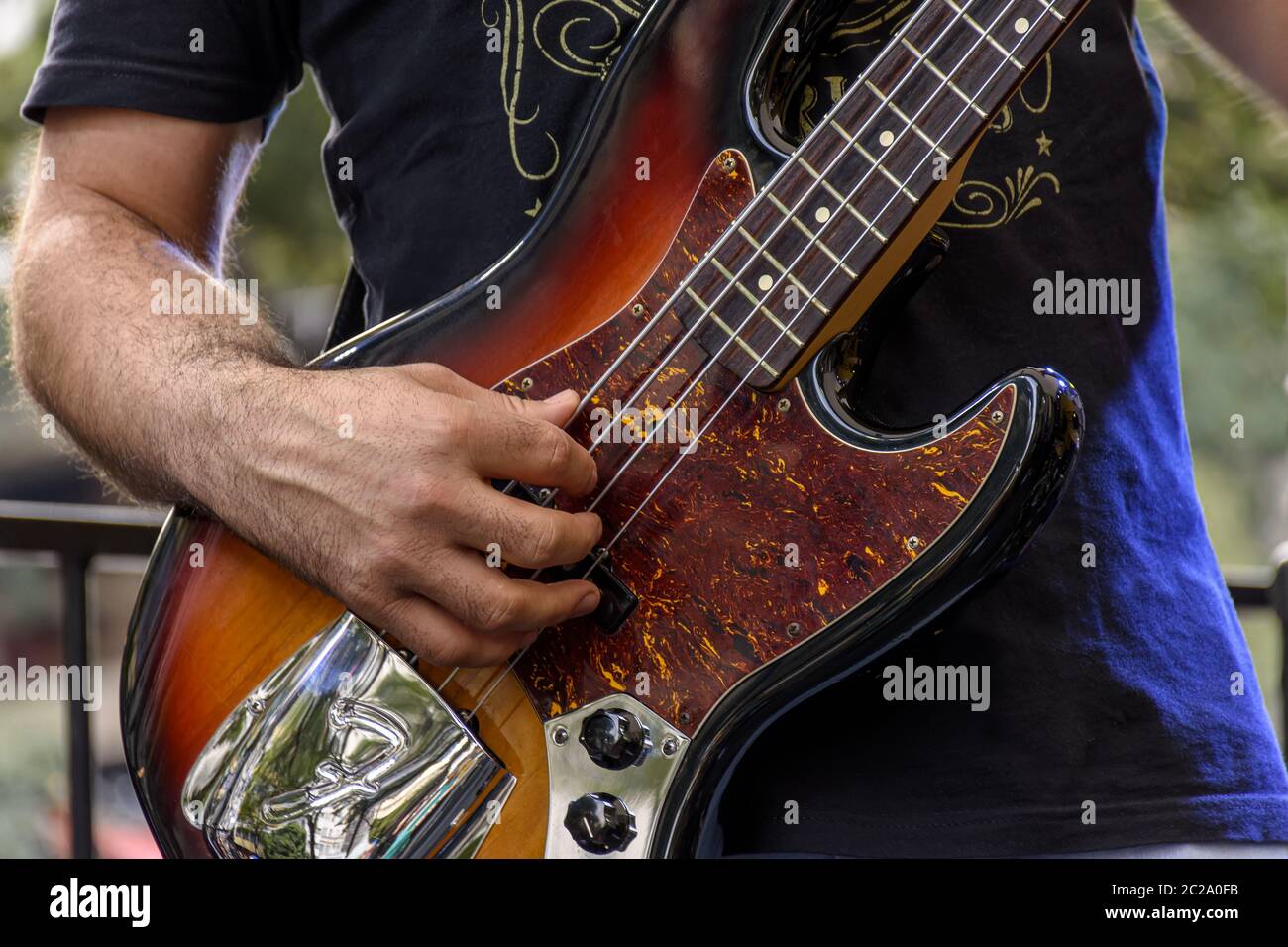 Hand playing bass guitar hi-res stock photography and images - Alamy