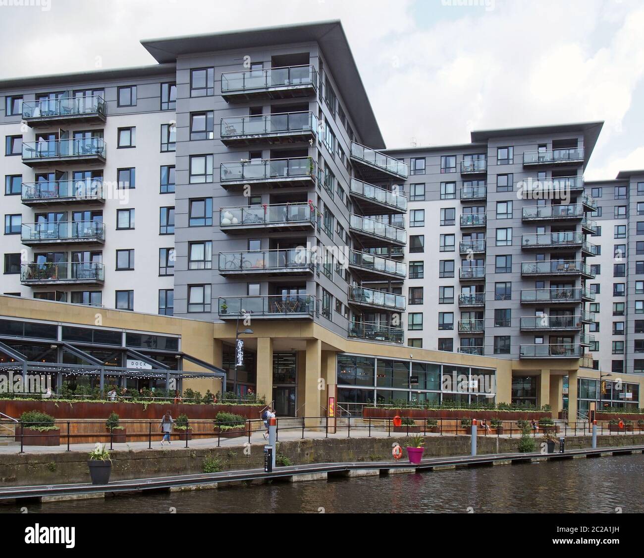 modern apartment developments and waterside bars around leeds dock ...