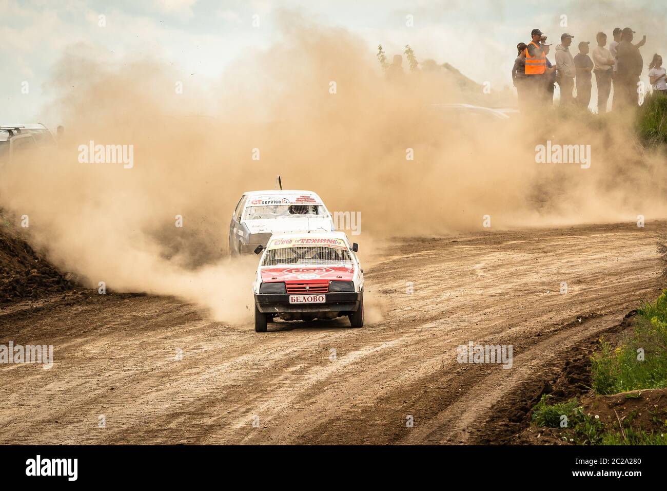Traditional rally .The racing car drives into a steep turn, scattering ...