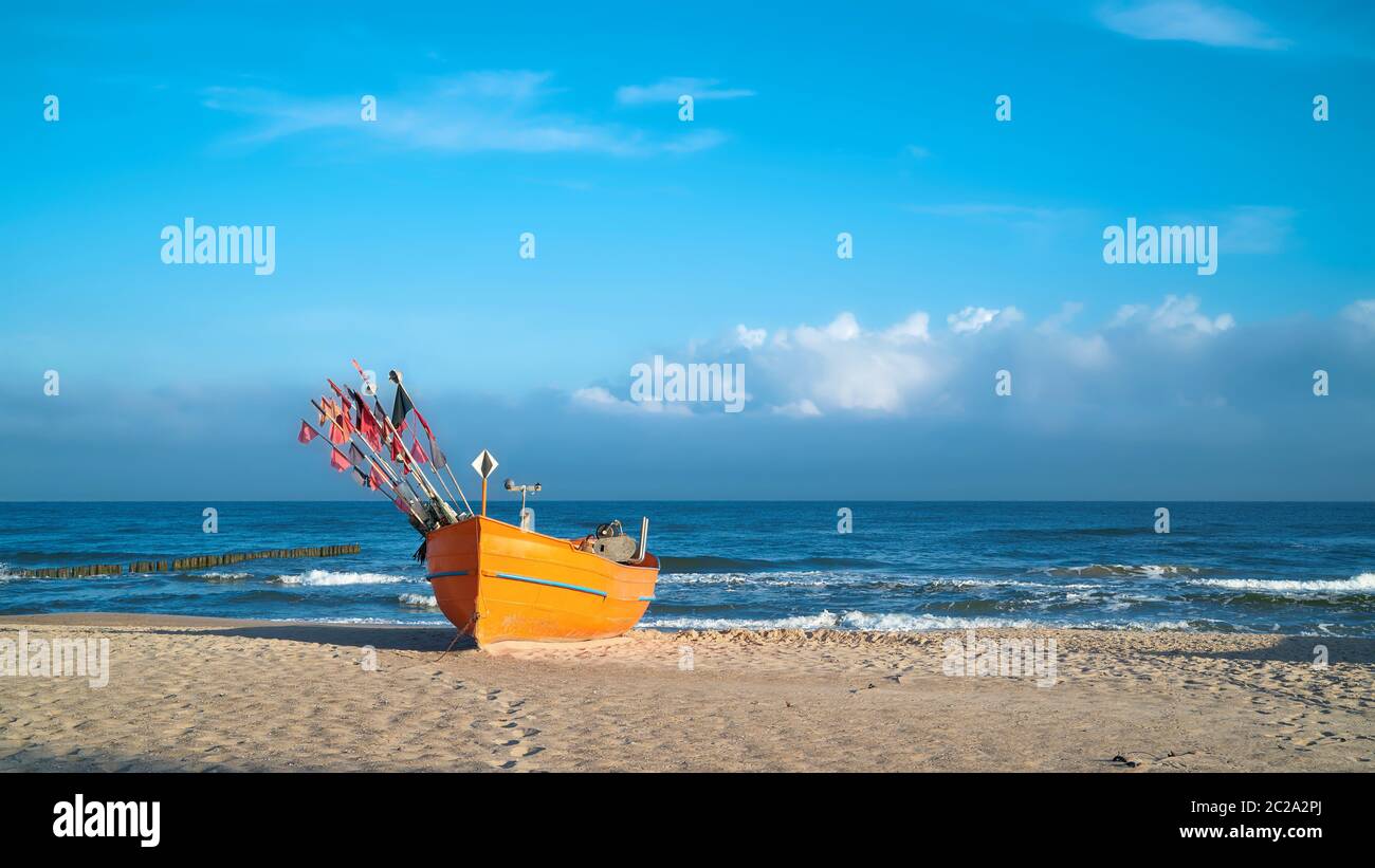 Fishing boat on Baltic sea beach at Rewal in Poland Stock Photo - Alamy