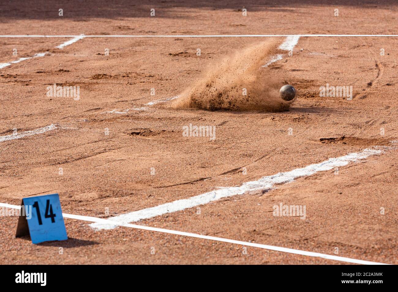 sphere landing in the sand at the shot put competition in stadium Stock ...