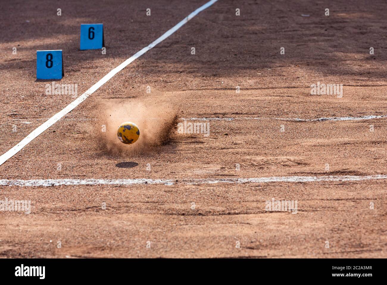 sphere landing in the sand at the shot put competition in stadium Stock ...