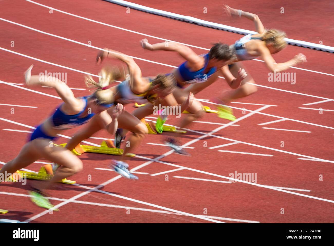 blurred ladies at the start in sprint competition Stock Photo - Alamy
