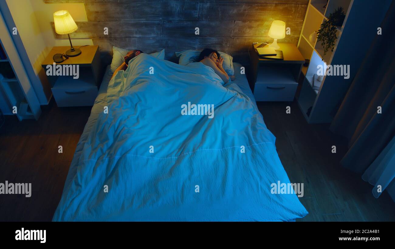 Couple sleeping in bed top view hi-res stock photography and images - Alamy
