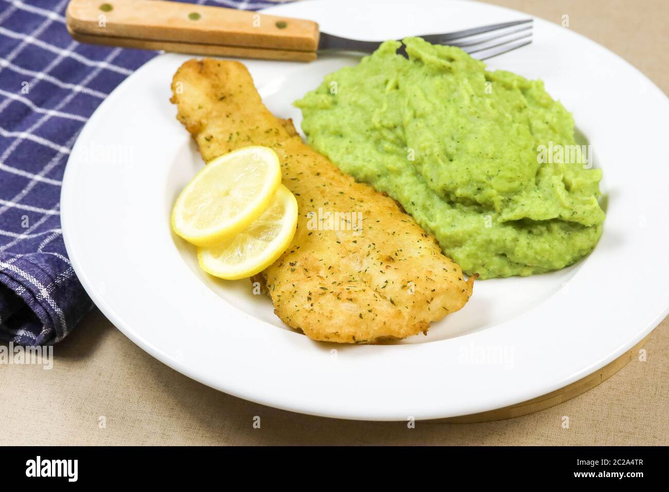 meunière fish fillet and green vegetable purée Stock Photo - Alamy