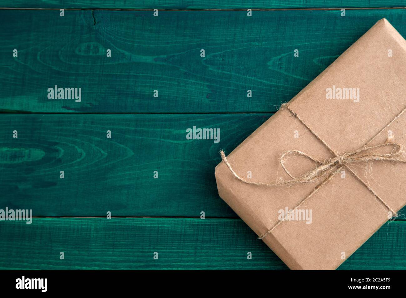 parcel,gift Packed in eco-friendly paper on dark green wooden ...