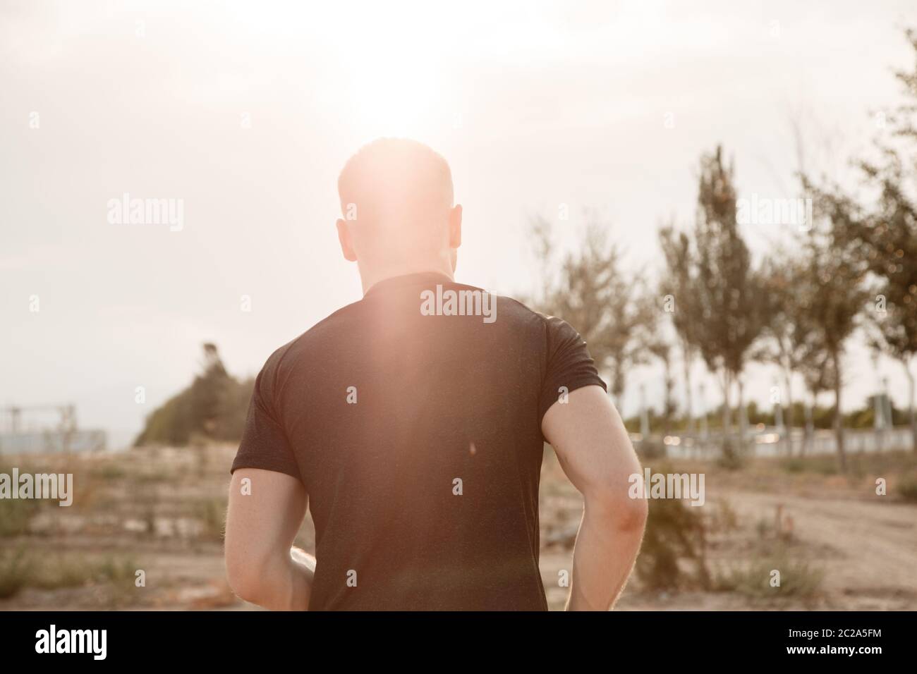Fit young guy, jogging outdoors hi-res stock photography and images - Alamy