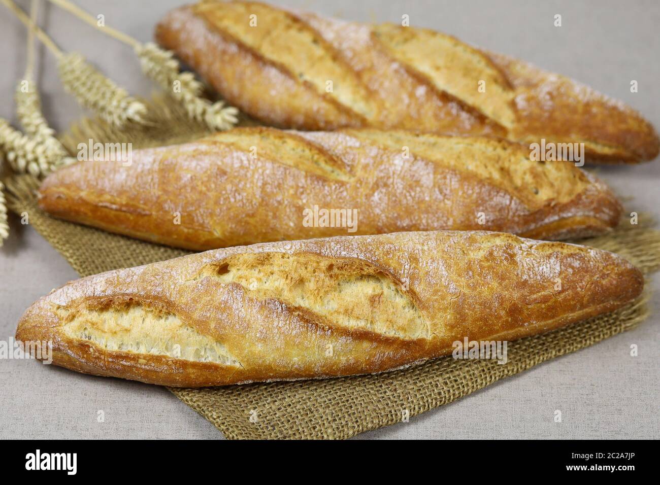 french bread baguettes on a table Stock Photo - Alamy