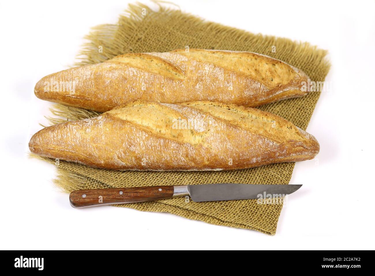 French bread sticks on a white background Stock Photo - Alamy