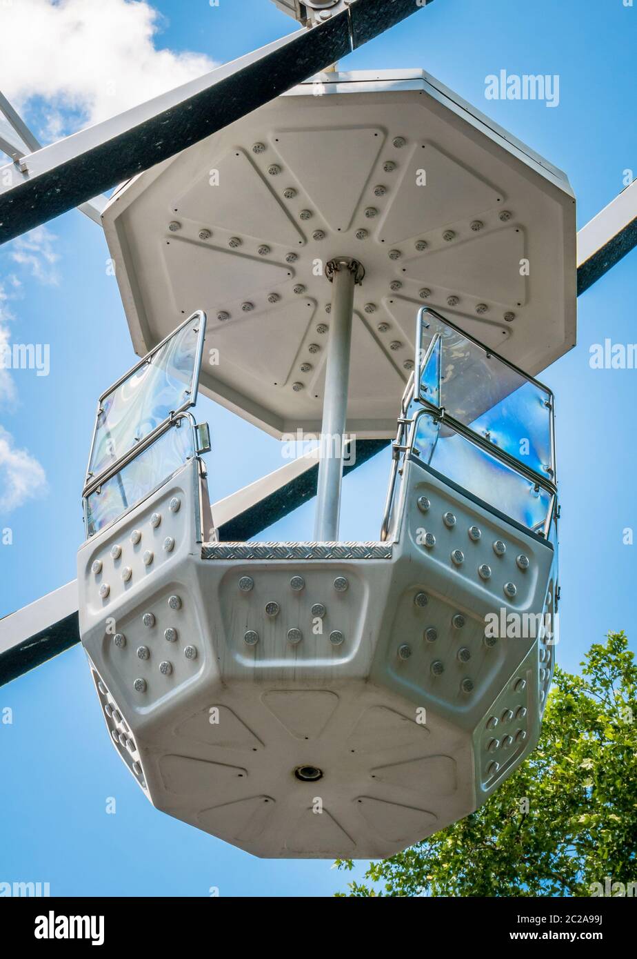 Detail of a ferris wheel cabin against blue sky Stock Photo - Alamy