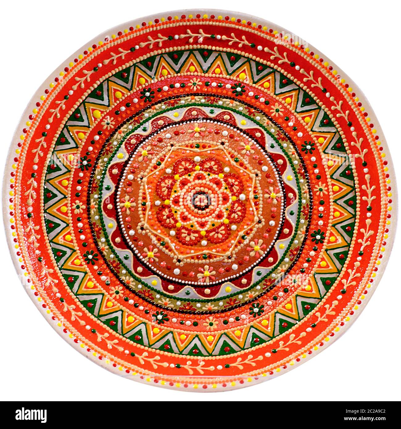 Decorative ceramic dish painted with a circular pattern, isolated on a ...