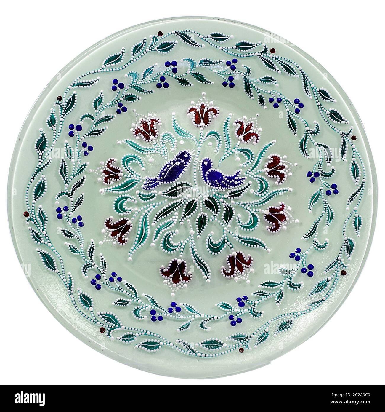 Decorative ceramic dish painted with a circular pattern, isolated on a ...
