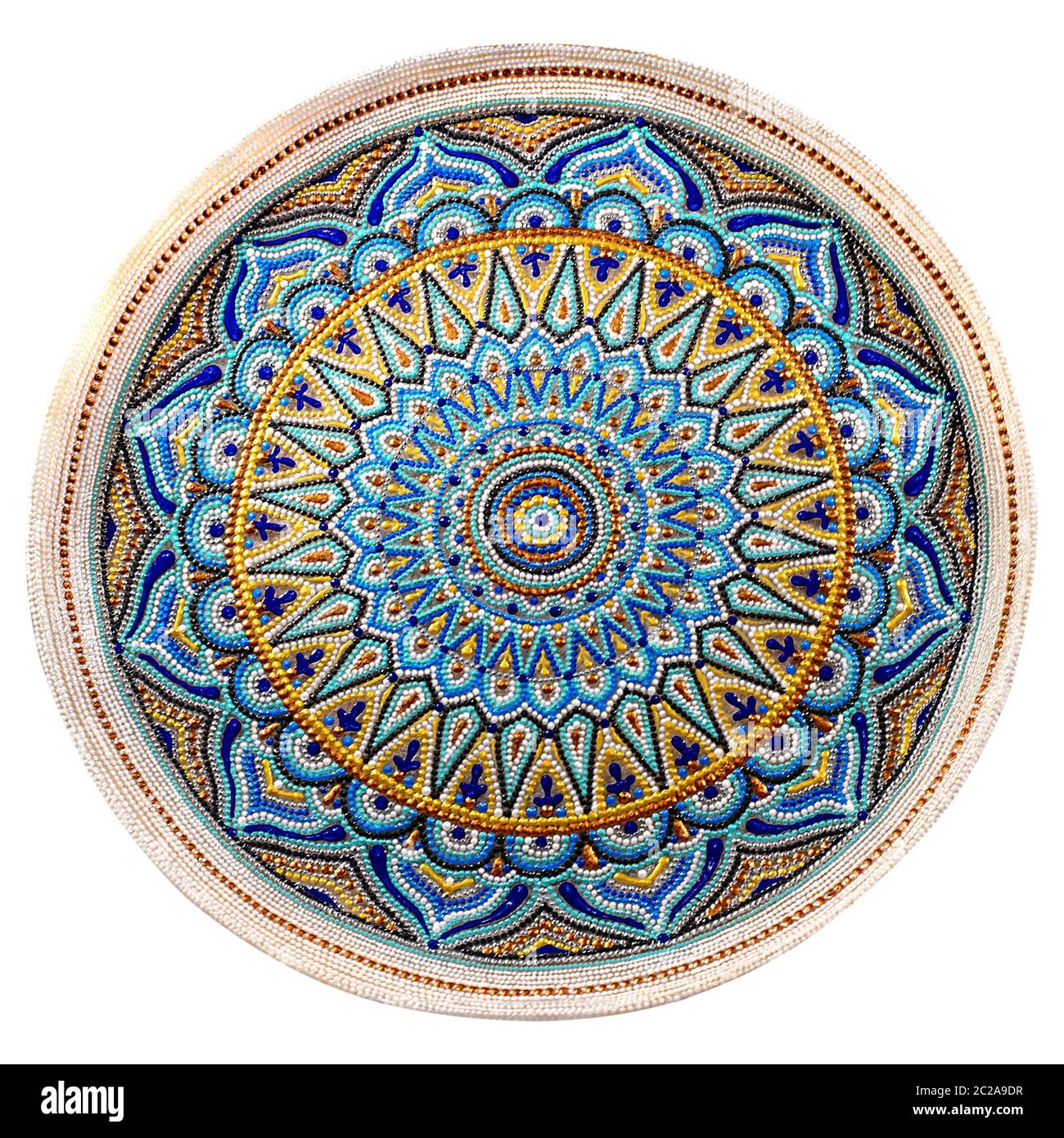 Decorative ceramic dish painted with a circular pattern, isolated on a ...
