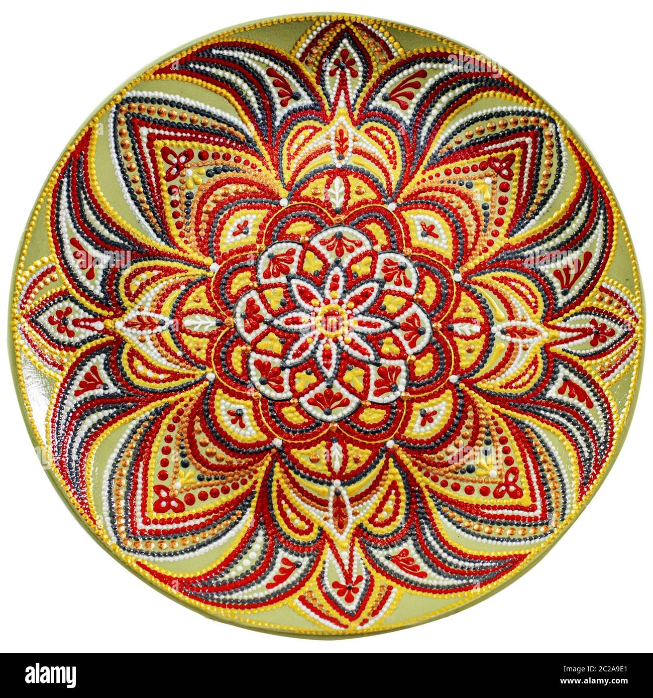 Decorative ceramic dish painted with a circular pattern, isolated on a ...
