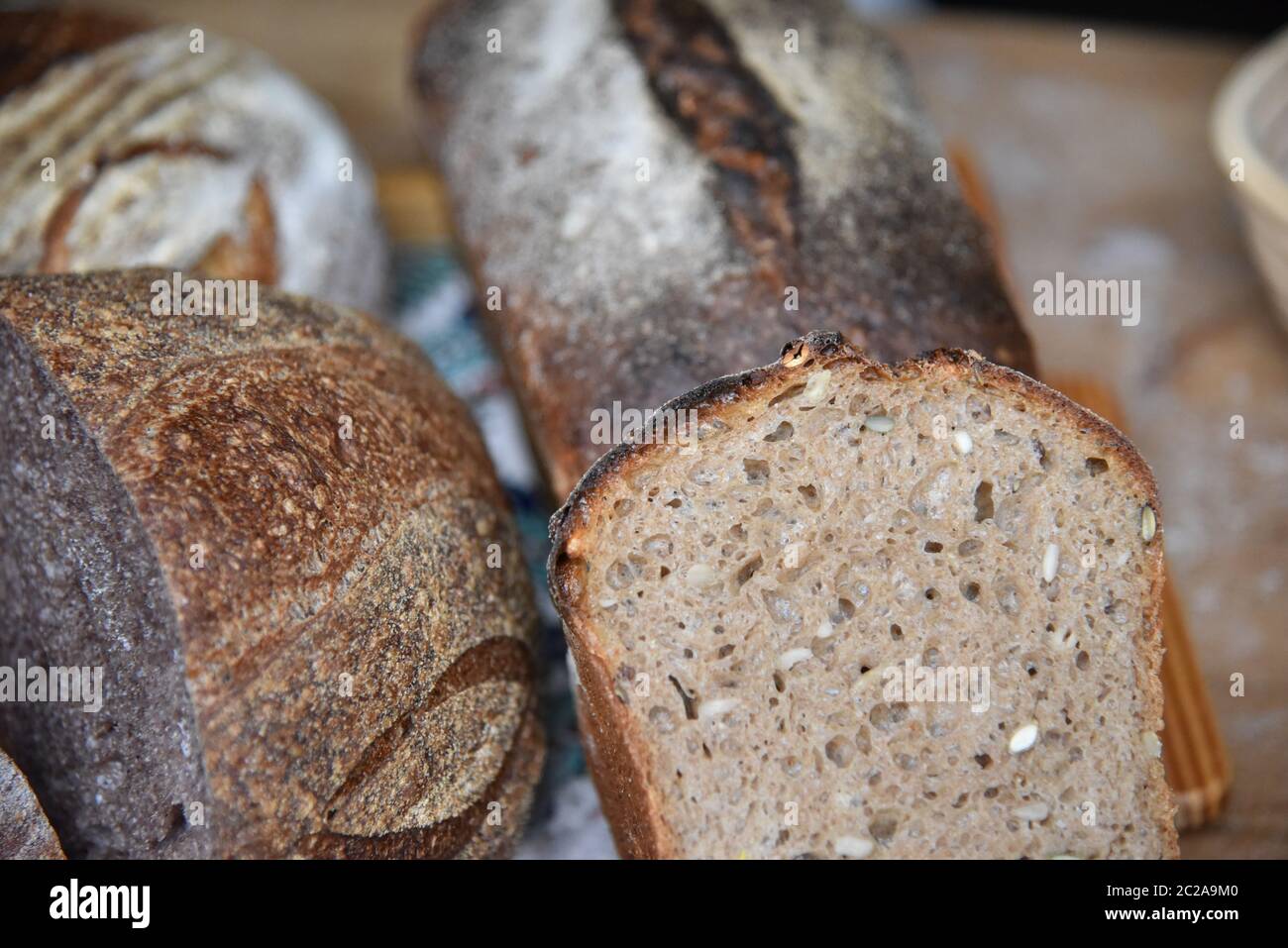 A fresh crusty loaf of homemade bread. Homemade rustic sour. Brown ...