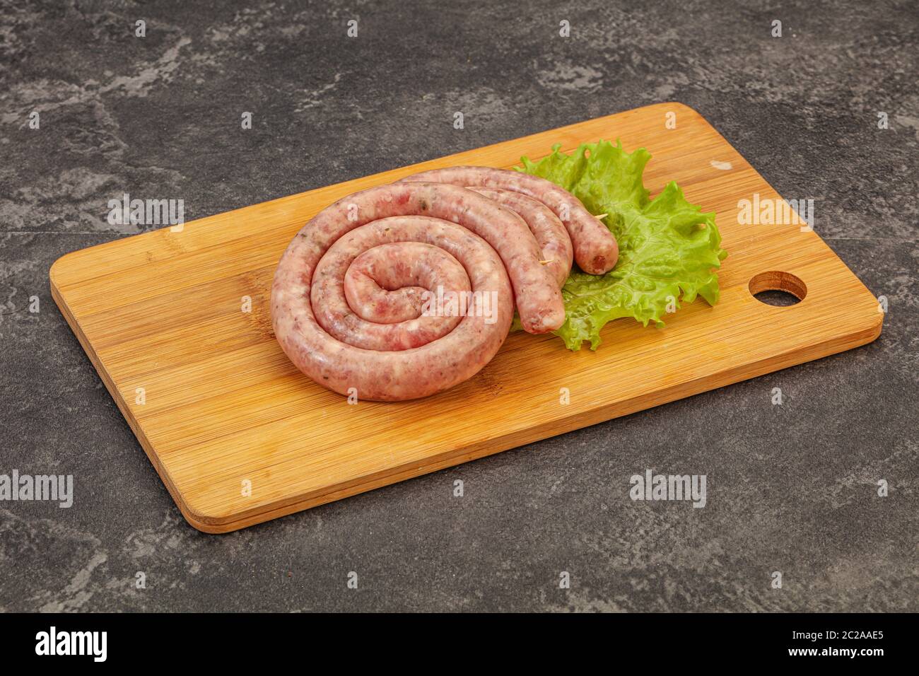 Raw pork sausage ring for grill Stock Photo - Alamy