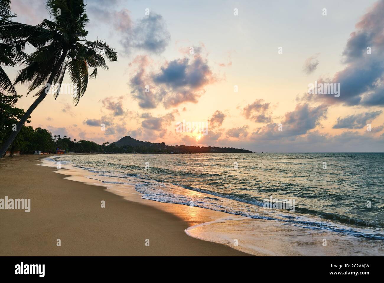 Amazing sunset at the beach on tropical island Stock Photo - Alamy