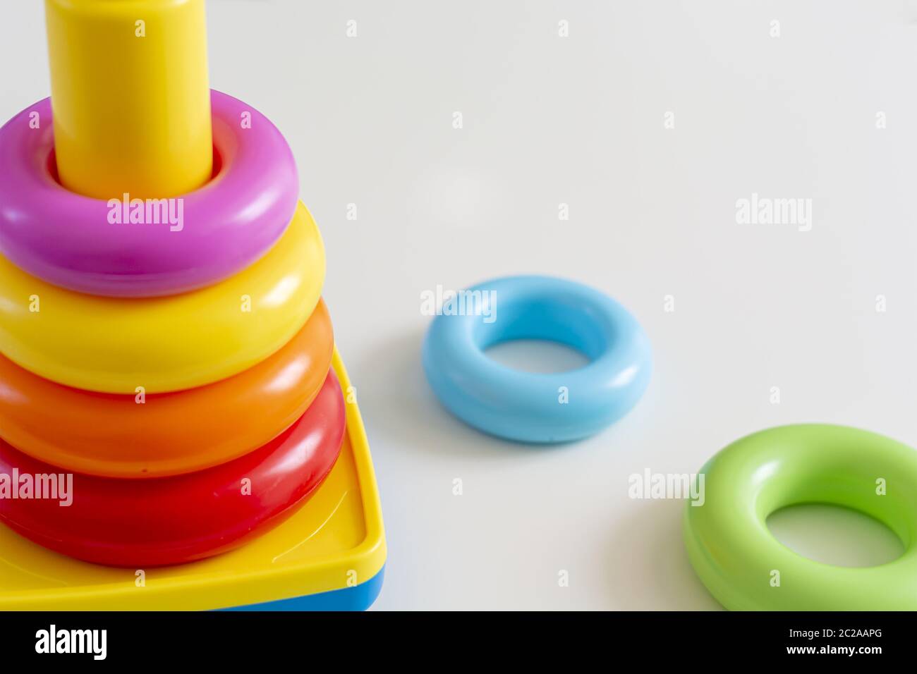 Colorful plastic rings stacked in a tower Stock Photo - Alamy