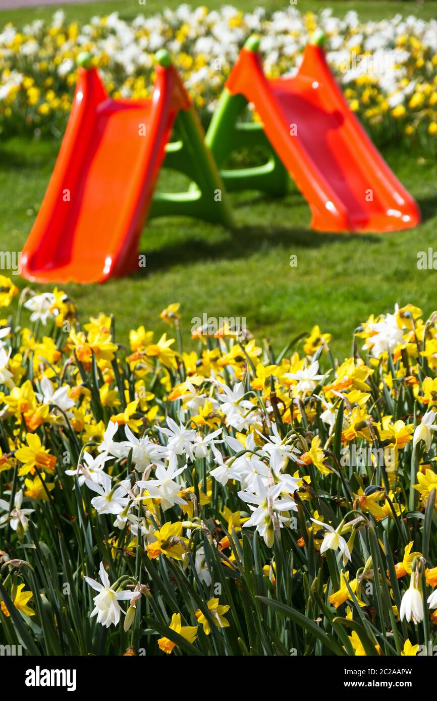 Beautiful orange playground slides for small children in the fresh ...