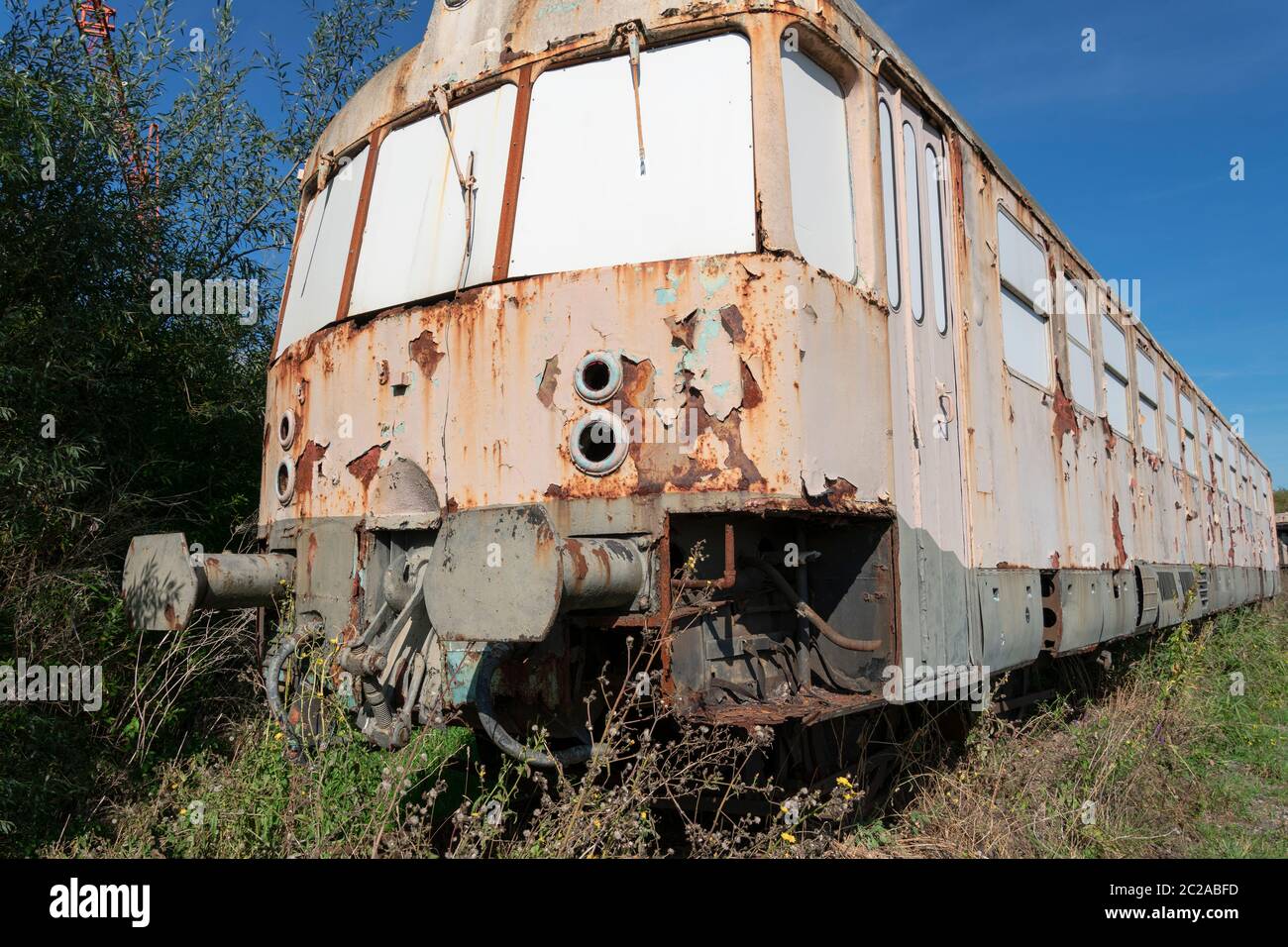 Old worn and abandoned train where the paint is already peeling and ...