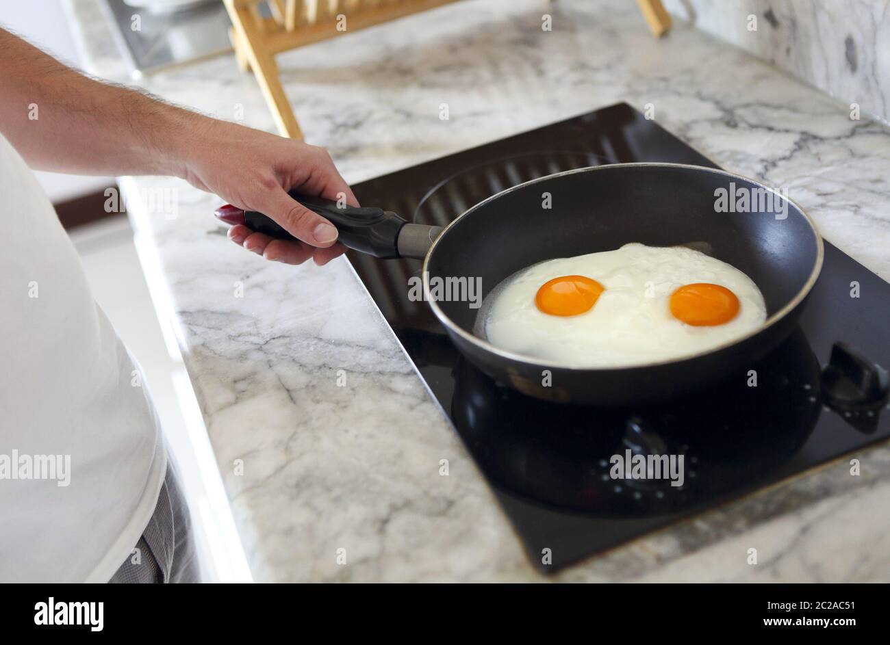 Person making scrambled eggs hi-res stock photography and images - Alamy