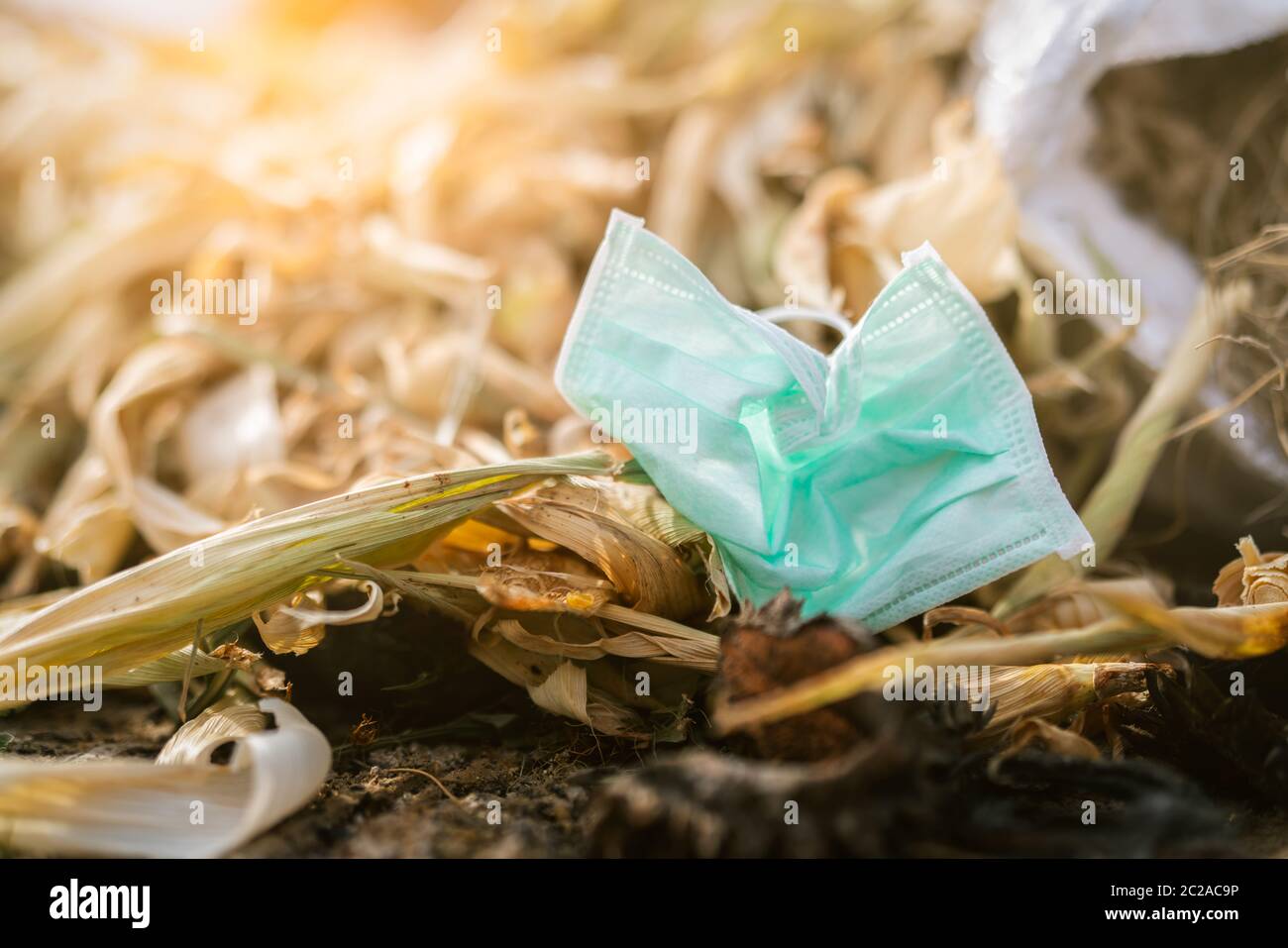 Used face mask discard in household garbage. Medical waste disposal ...
