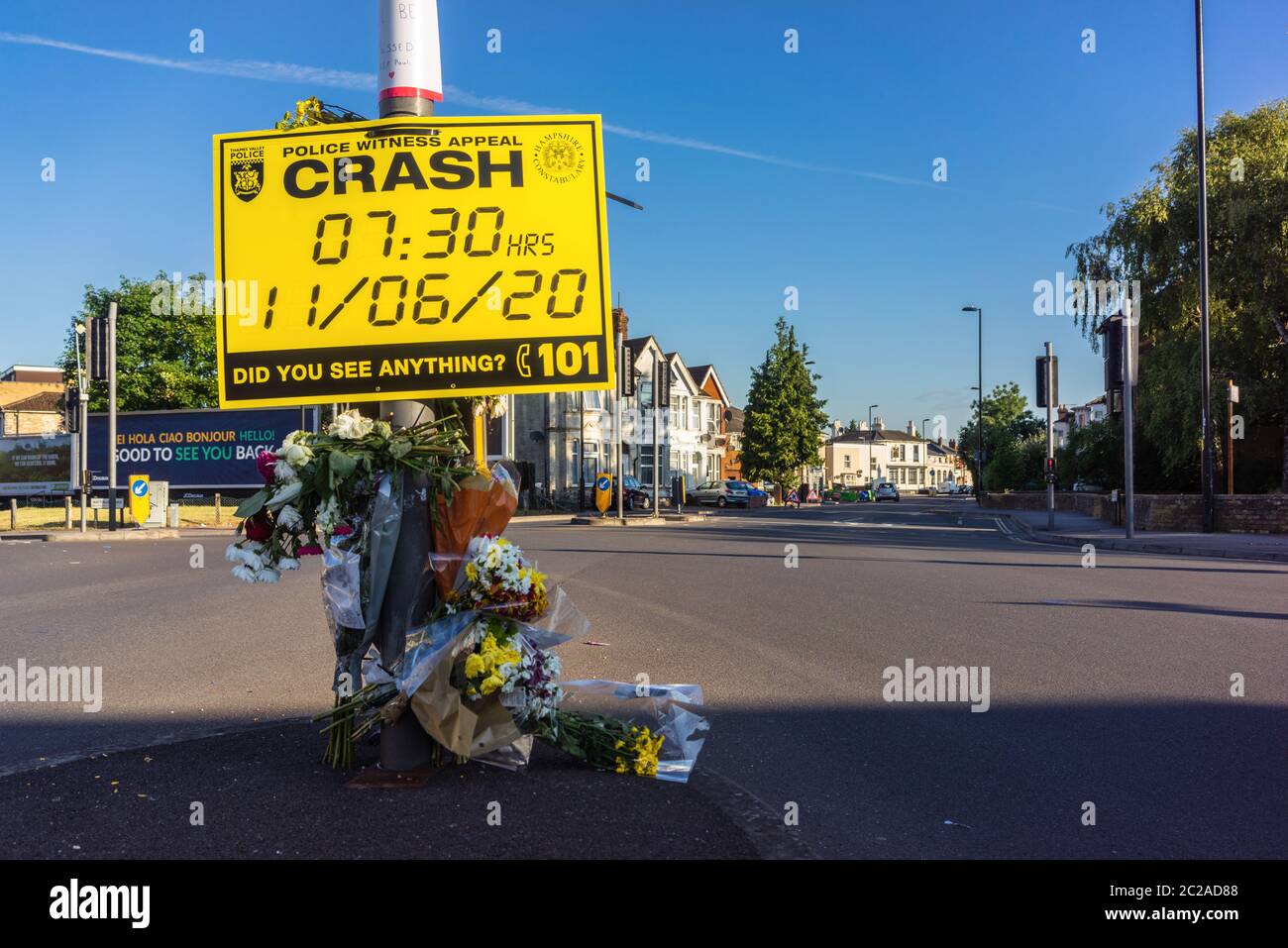 Yellow police witness appeal sign at the site of a traffic accident at ...