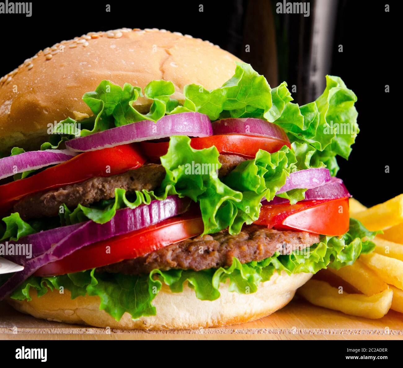 Burger served in bun in nutrition fast food concept Stock Photo - Alamy